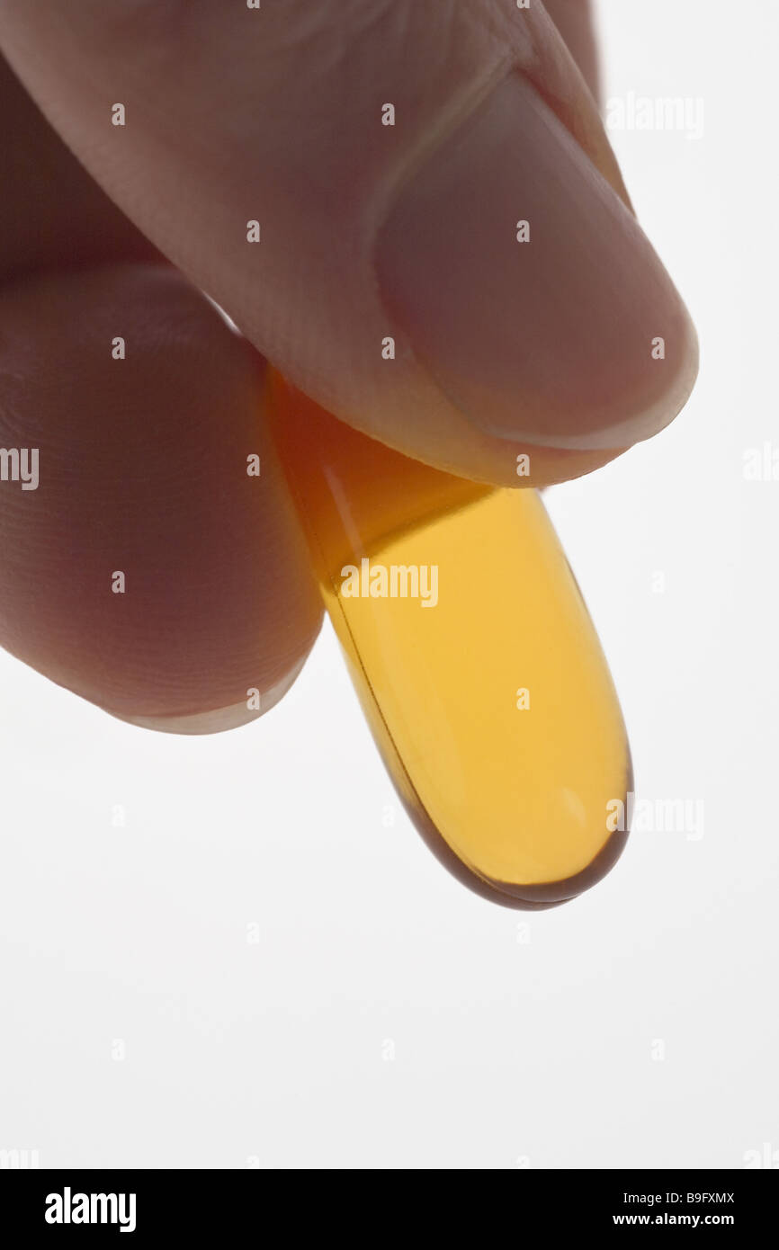 Medicine hand capsule detail Stock Photo - Alamy