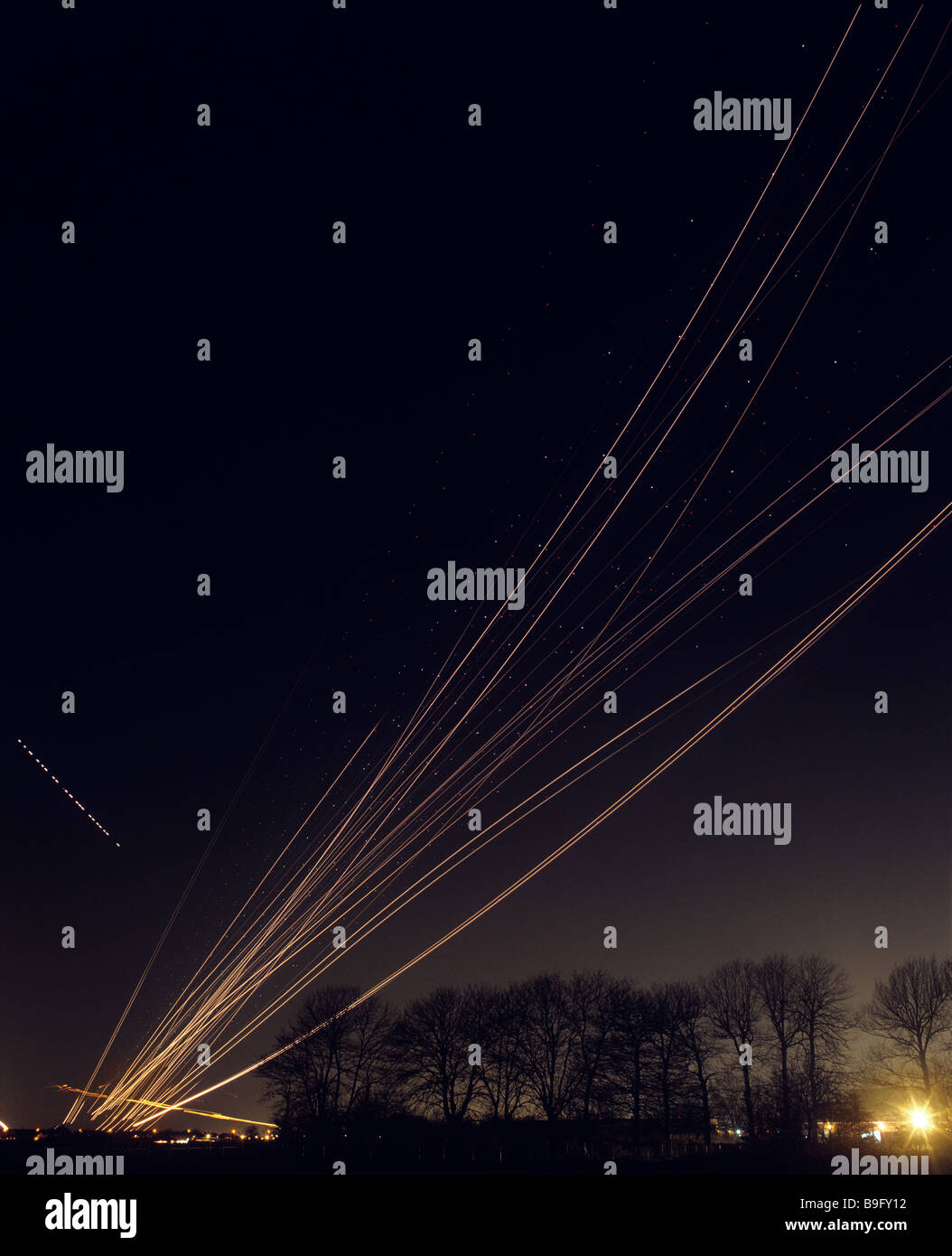 The lights of aircraft taking off from London airport during a long ...