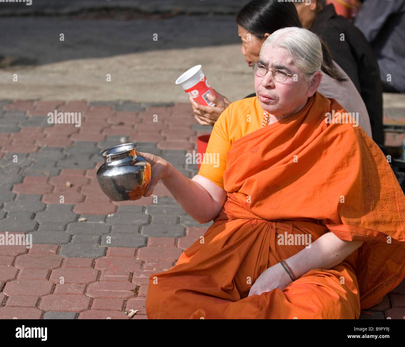Buddist monks asking for donations Stock Photo - Alamy