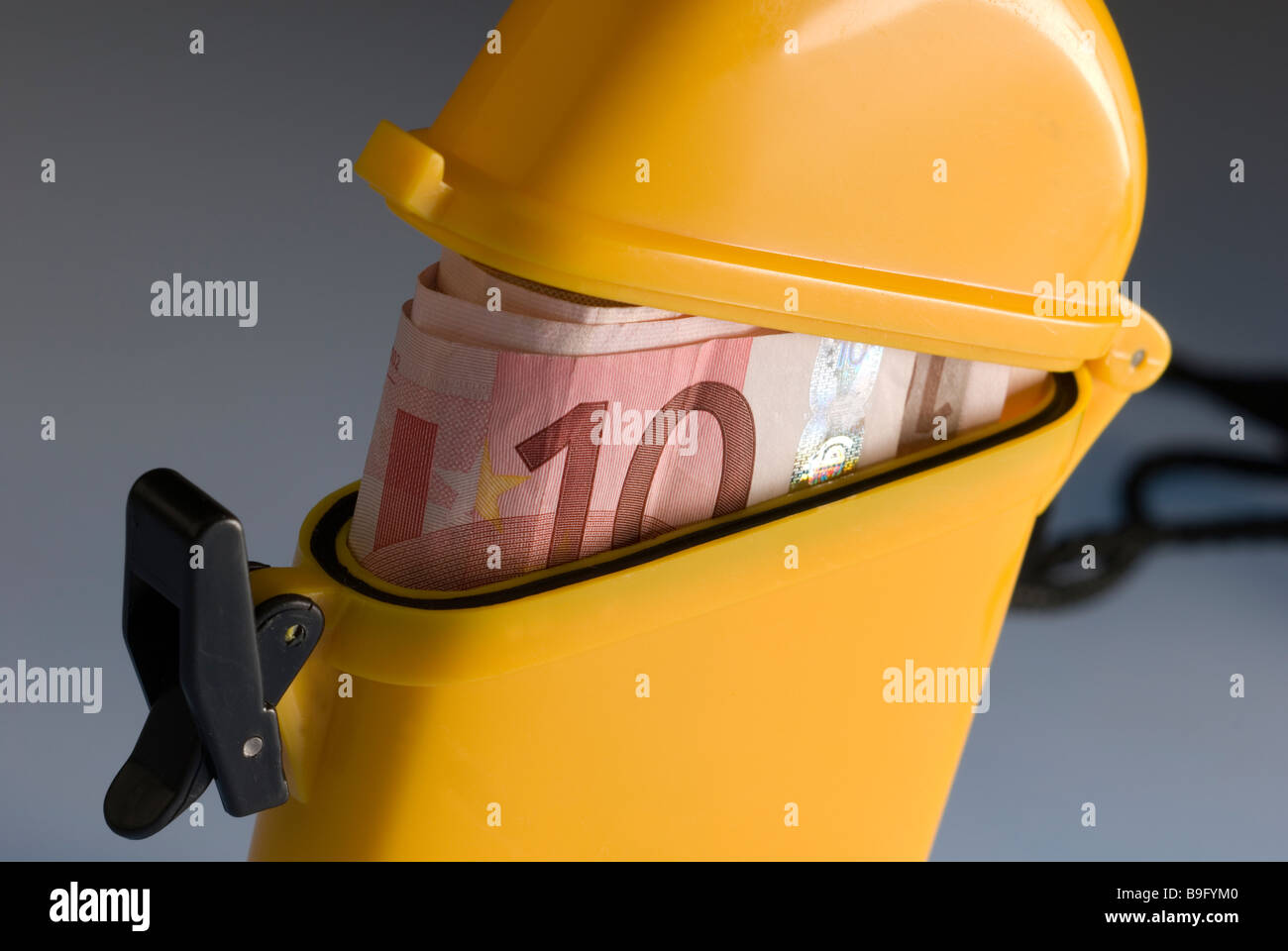 ten euros in a waterproof money container on a grey background Stock ...