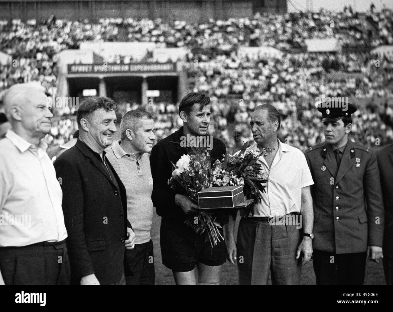 Dynamo Moscow football club goalkeeper Lev Yashin centre receiving ...