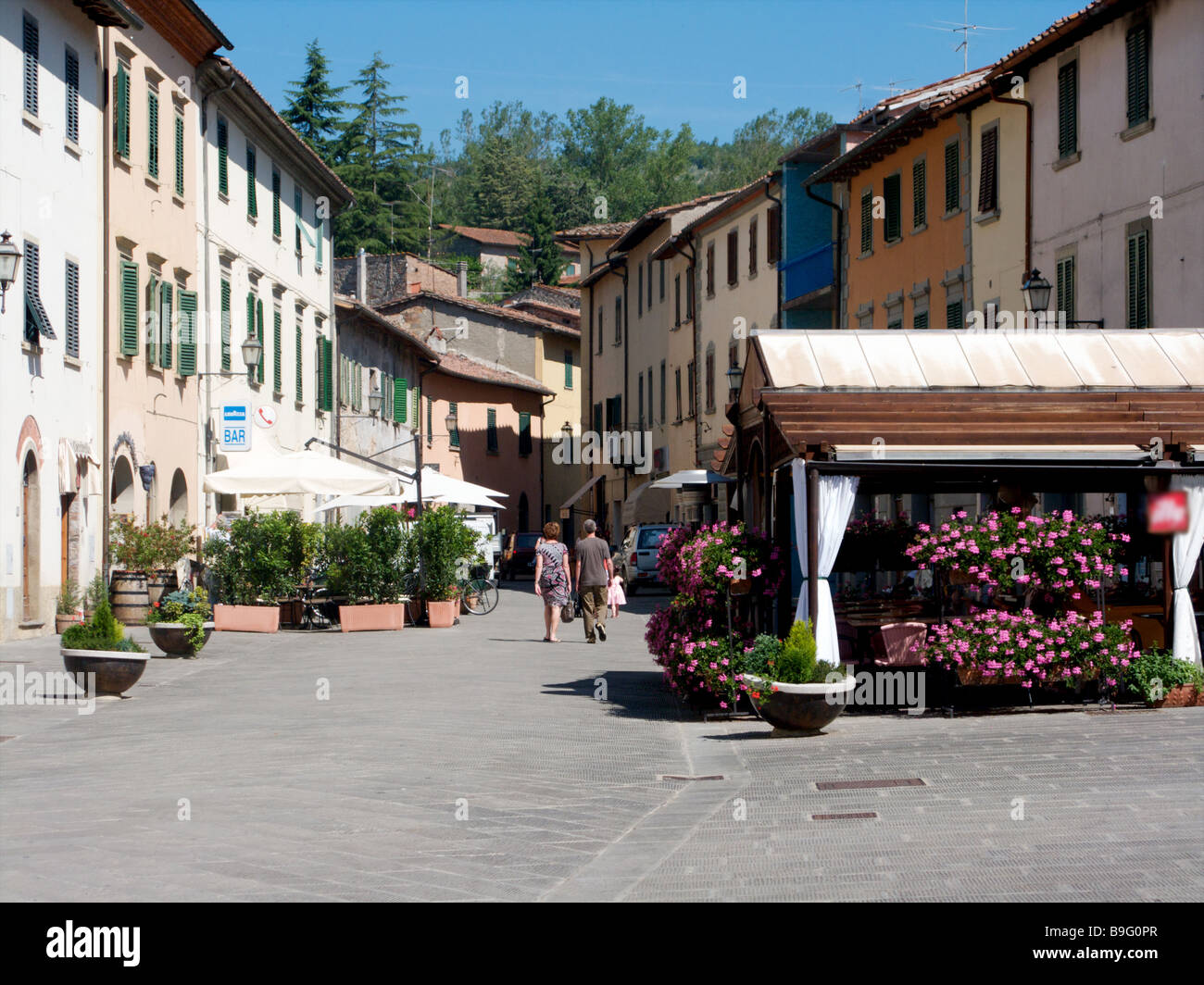 The main square in the village of borgo di gaiole in Italy with coffee ...