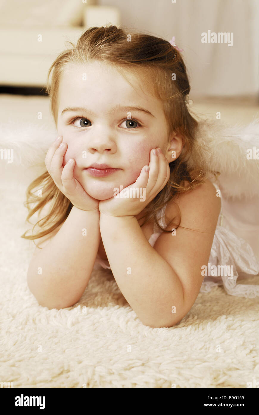 christmas girl disguise angels floor lying portrait series people child ...