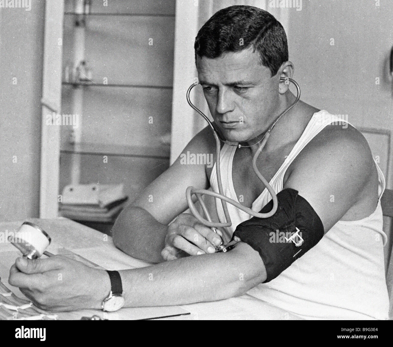 Cosmonaut Vladislav Volkov measures his blood pressure before training ...