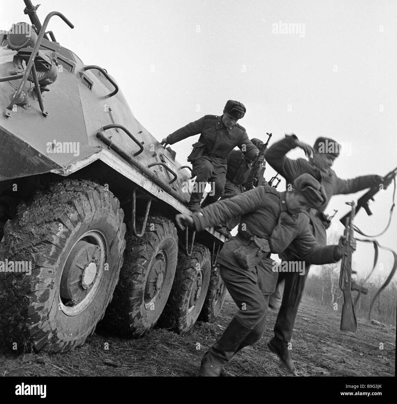 Frontier guards jumping down from an armored personnel carrier during ...