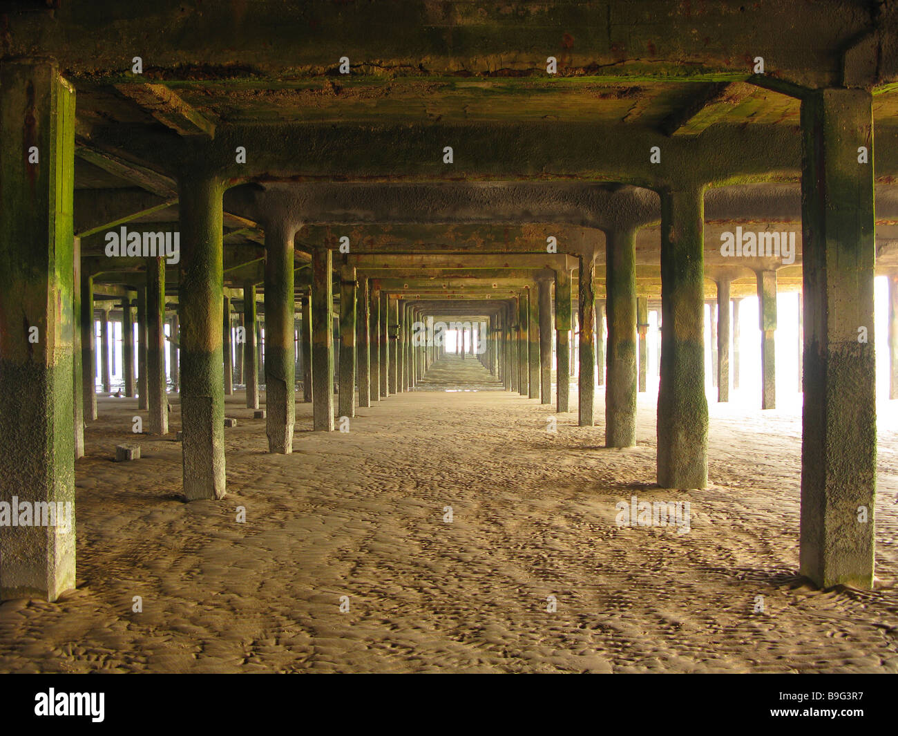 Abstract perspective image of a beach under a pier Stock Photo - Alamy
