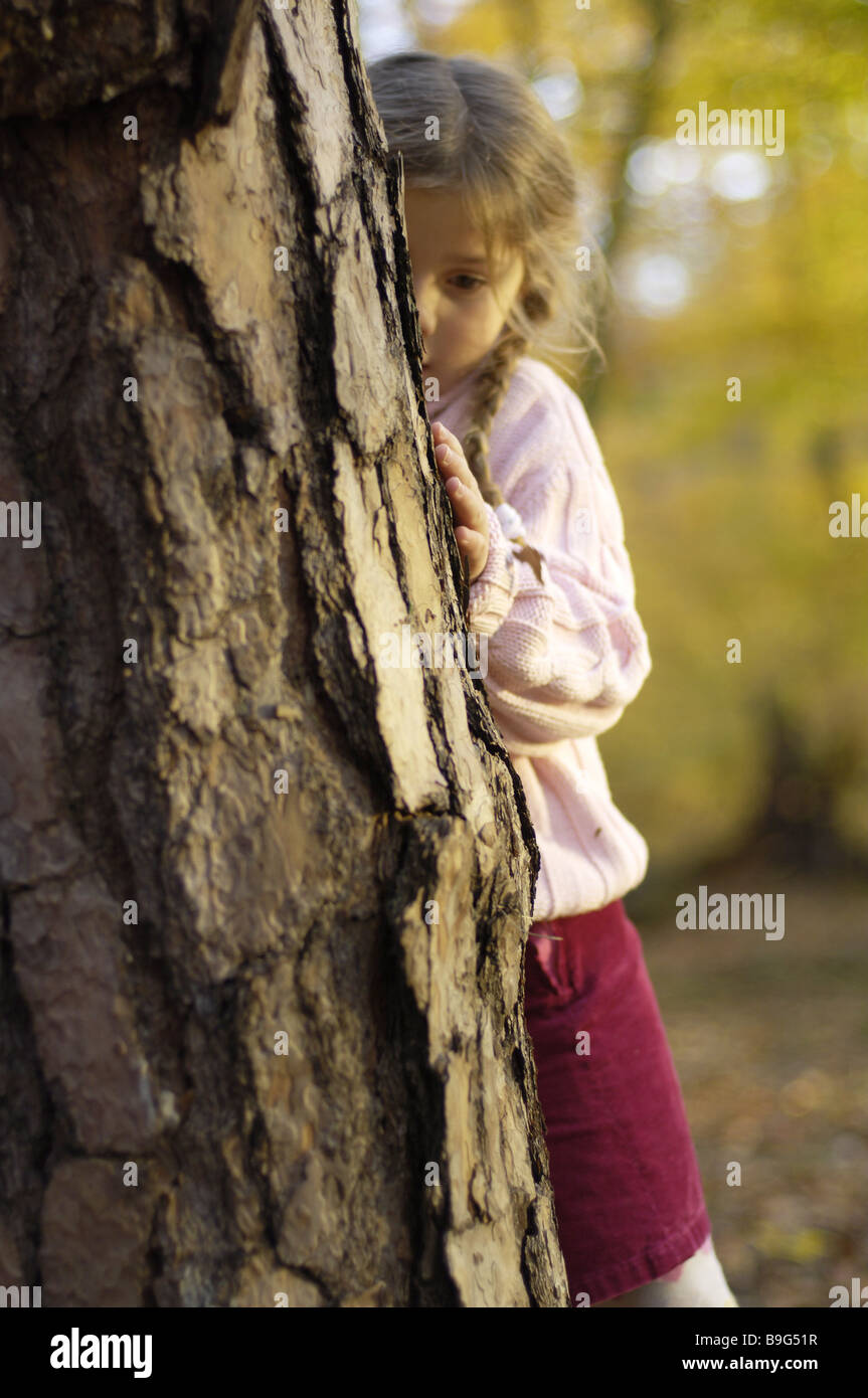 Girl touches bark tree tree hi-res stock photography and images - Alamy