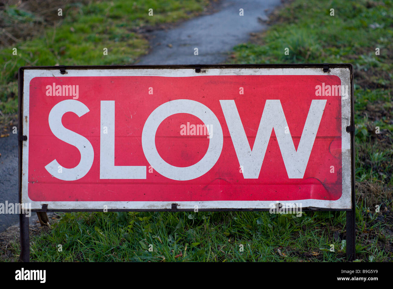 Road sign slow hi-res stock photography and images - Alamy