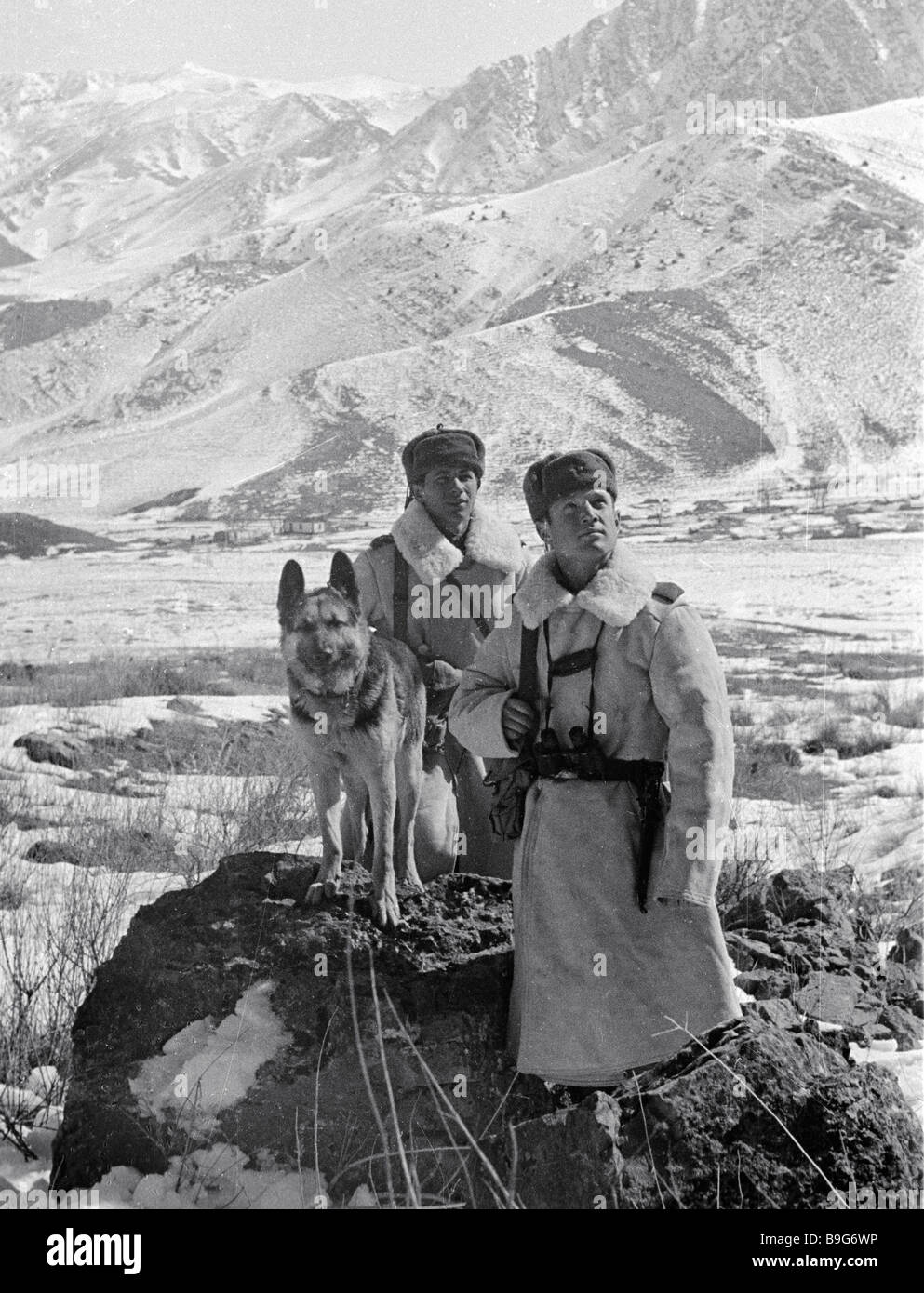 Frontier guards with the dog guarding the frontier Stock Photo - Alamy