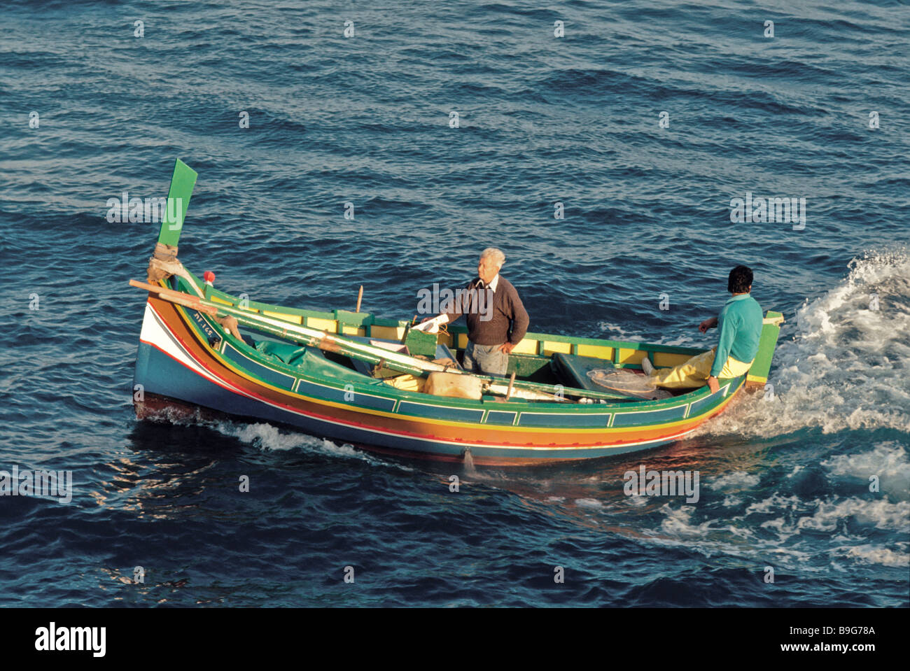An indigenous luzzu fishing boat off Gozo Malta Maltese Islands ...