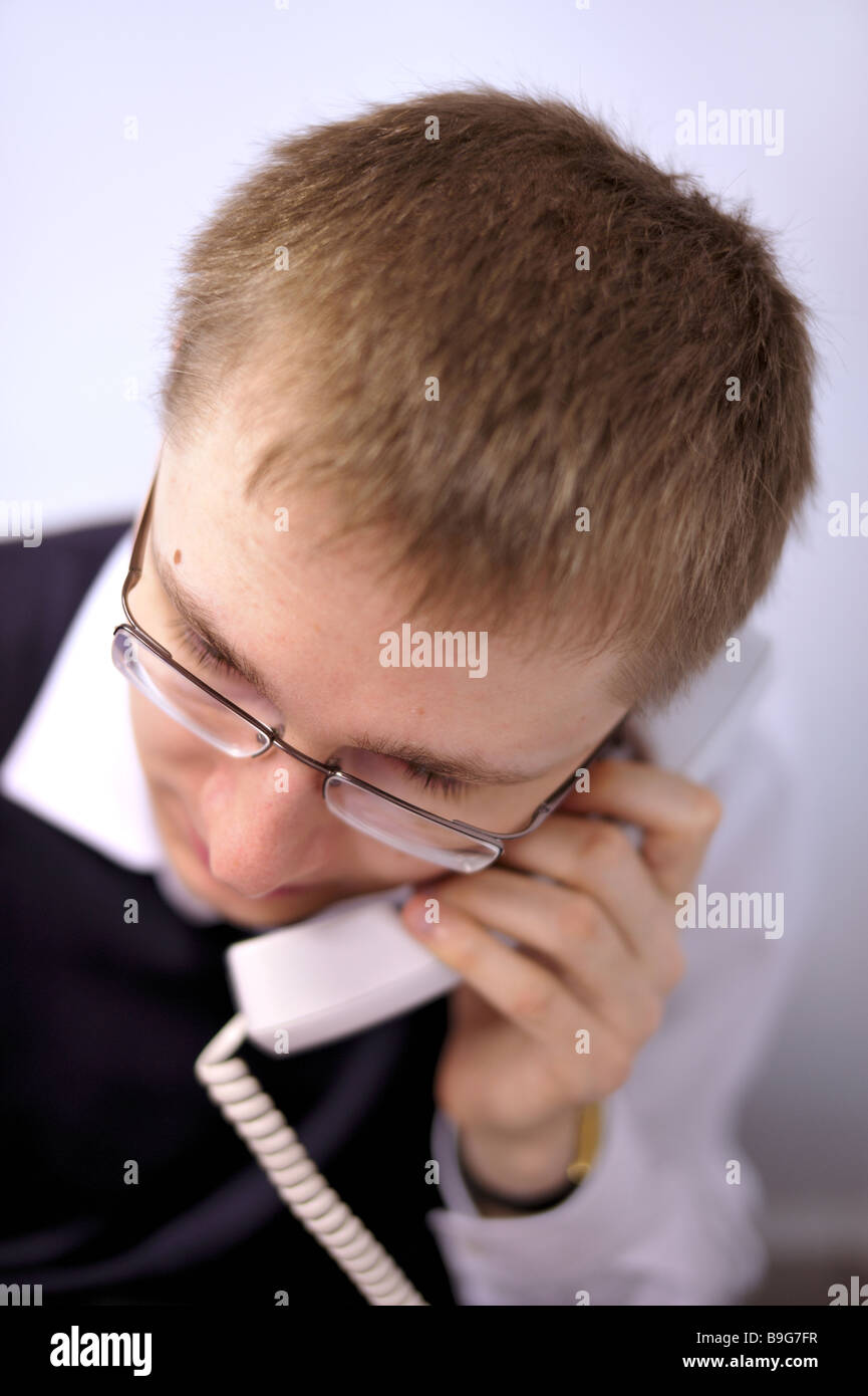 Young man speaking by telephone Stock Photo - Alamy
