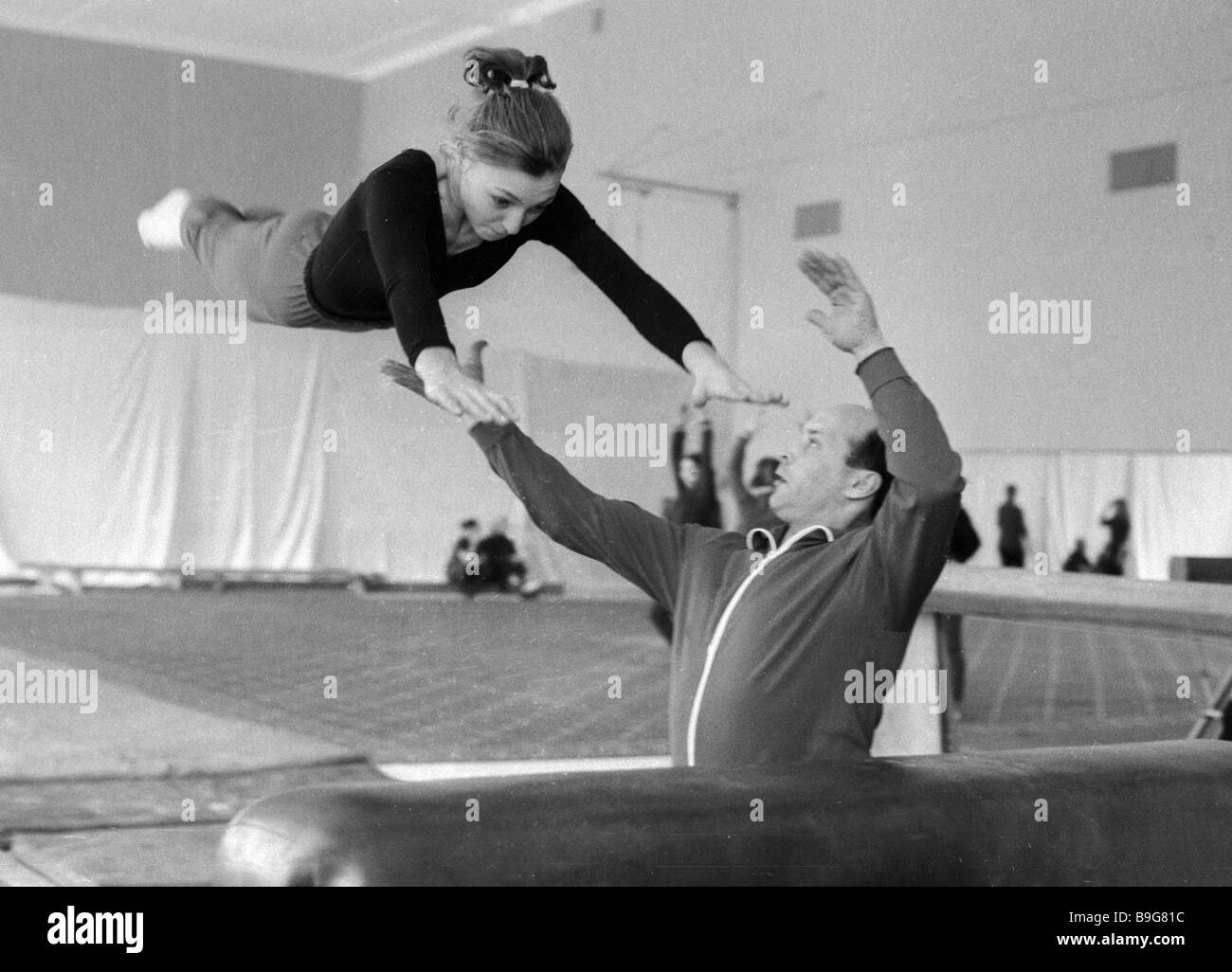 Soviet gymnast Natasha Kuchinskaya left with her coach Yury Popov right ...