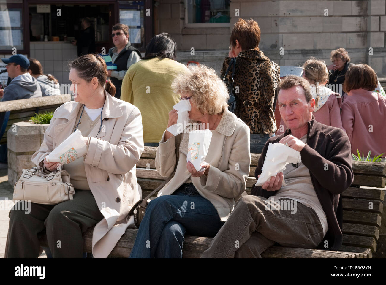 family eating fish and chips at the seaside Stock Photo - Alamy