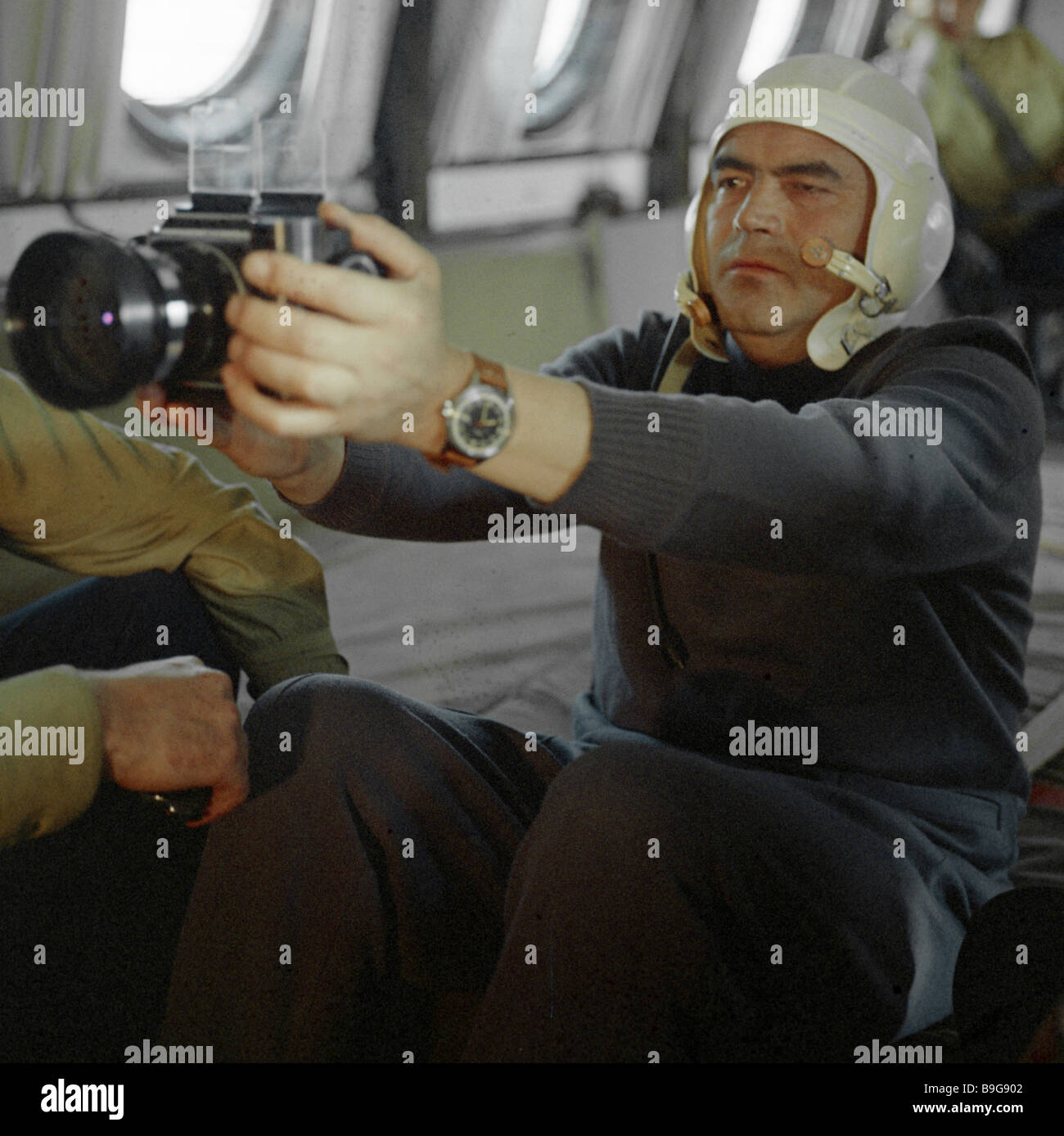 Pilot cosmonaut Andriyan Nikolayev learning to take pictures under zero ...