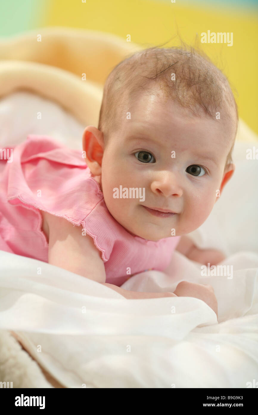 Baby lying prone position head lifts kindly portrait 5 months wakened ...