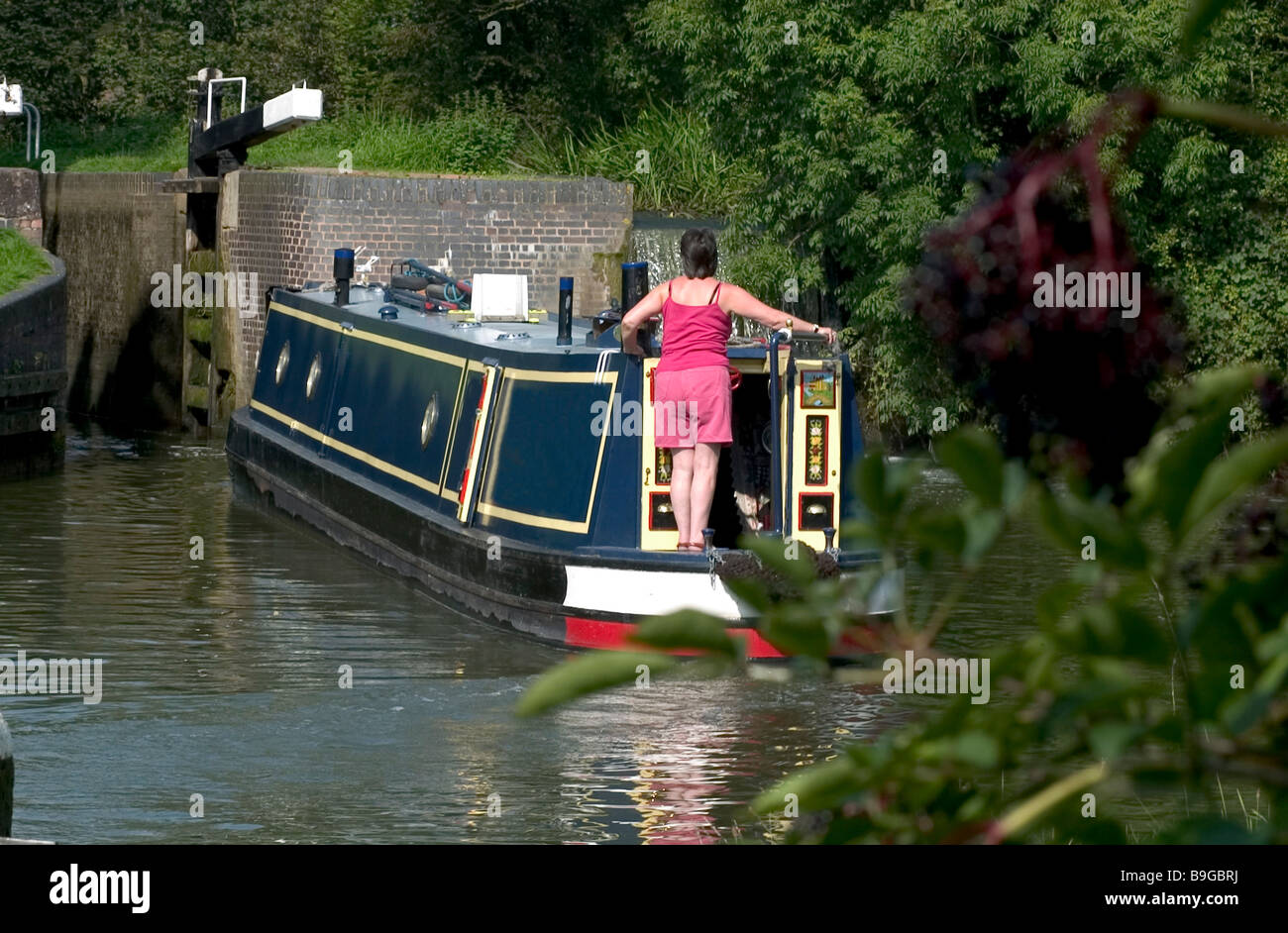 Rear view of canal boat sailing on river Stock Photo - Alamy