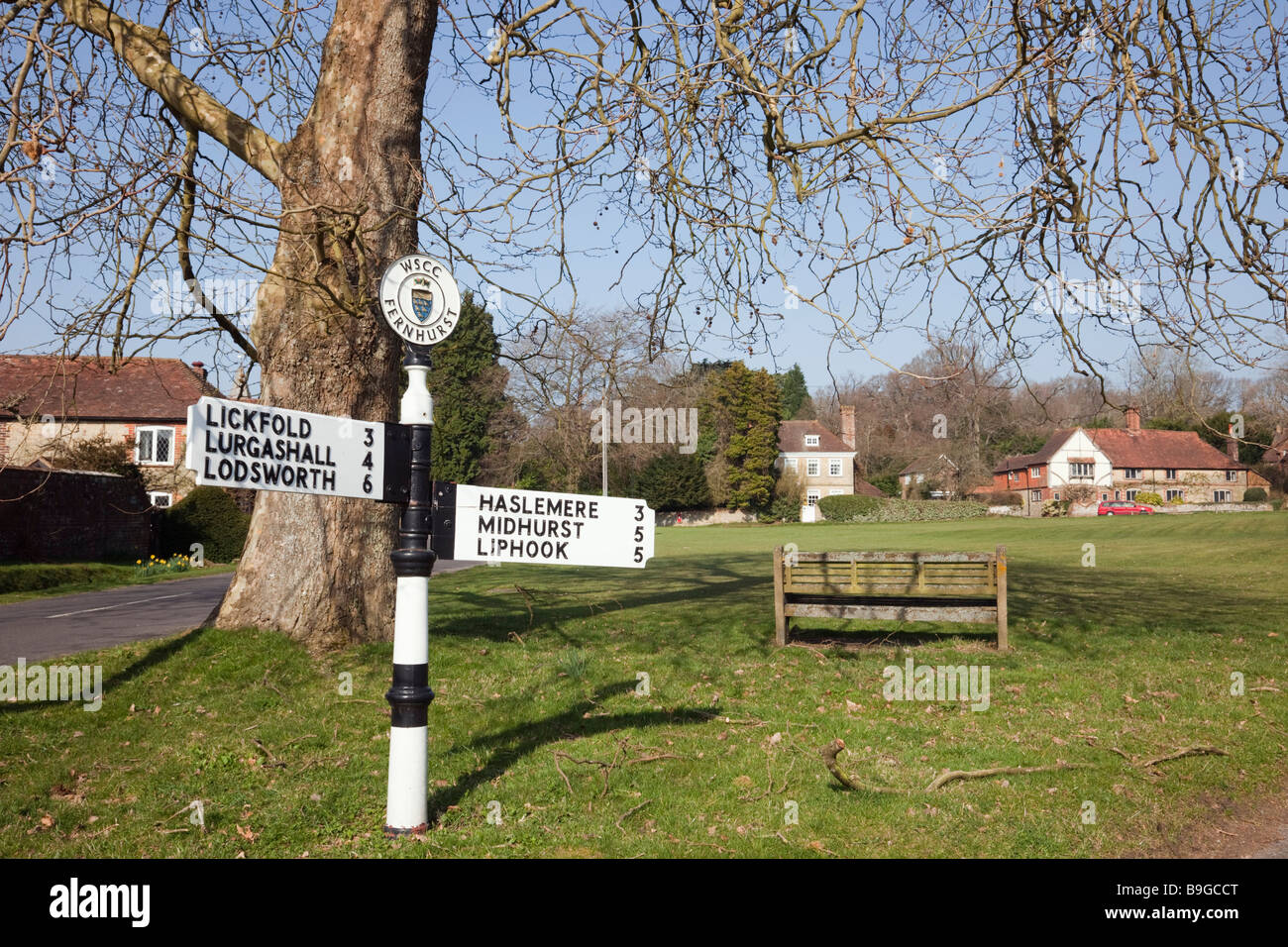 Village green with traditional old signpost in Fernhurst West Sussex ...
