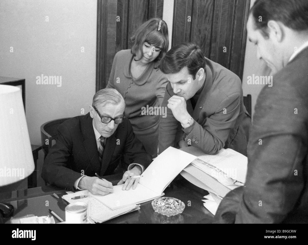 French artist Jean Effel left giving autographs to Muscovites Stock ...