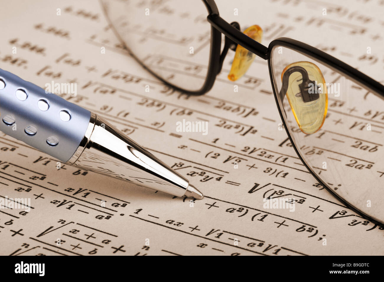 Pen and glasses over a math sheet Stock Photo - Alamy