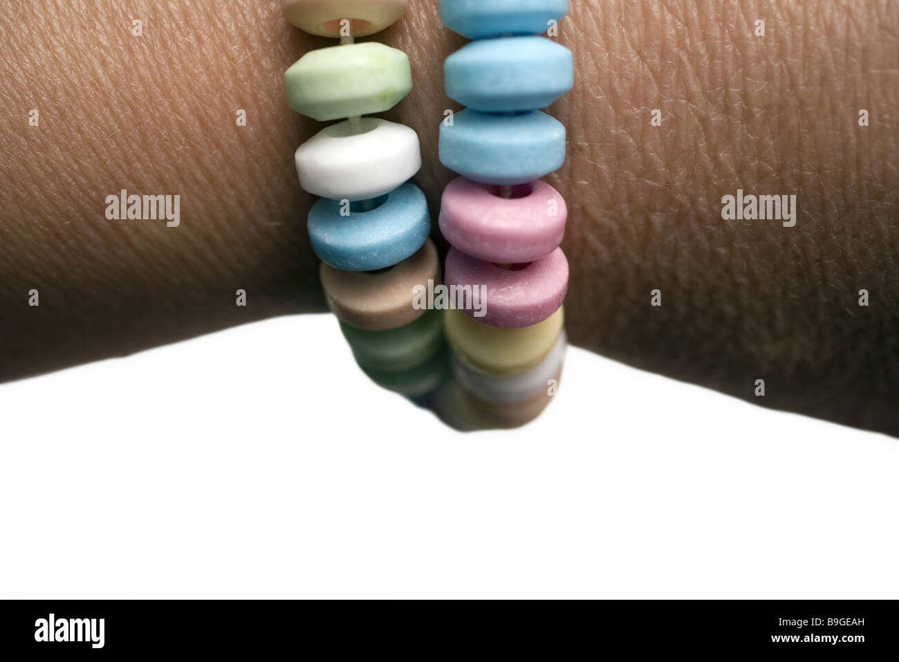 Candies candy-chain wrist Stock Photo - Alamy