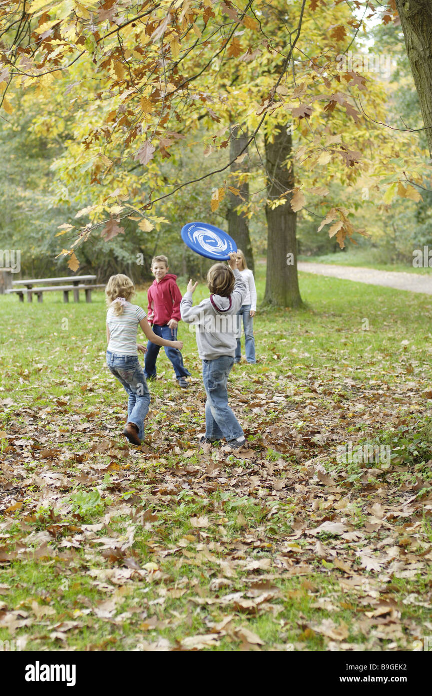 Children girl boys forest cheerfully Frisbee friends play 8-12 years ...