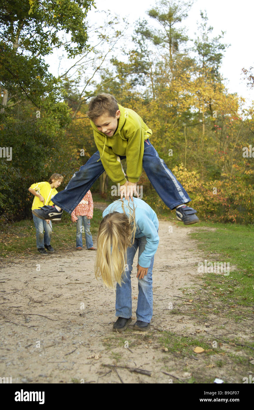 Boys play leapfrog hi-res stock photography and images - Alamy