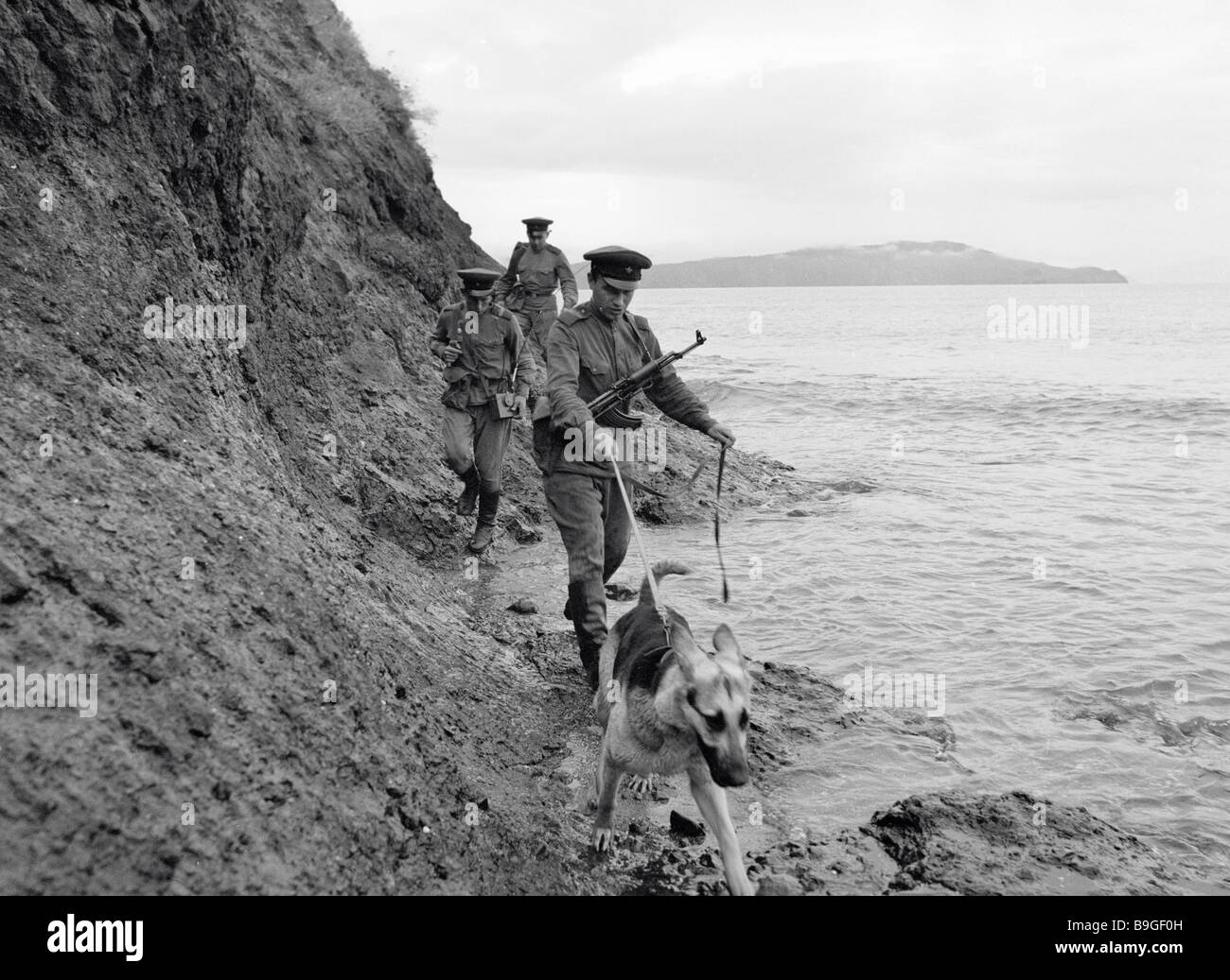 Frontier guards on patrol on the ocean coast Stock Photo - Alamy