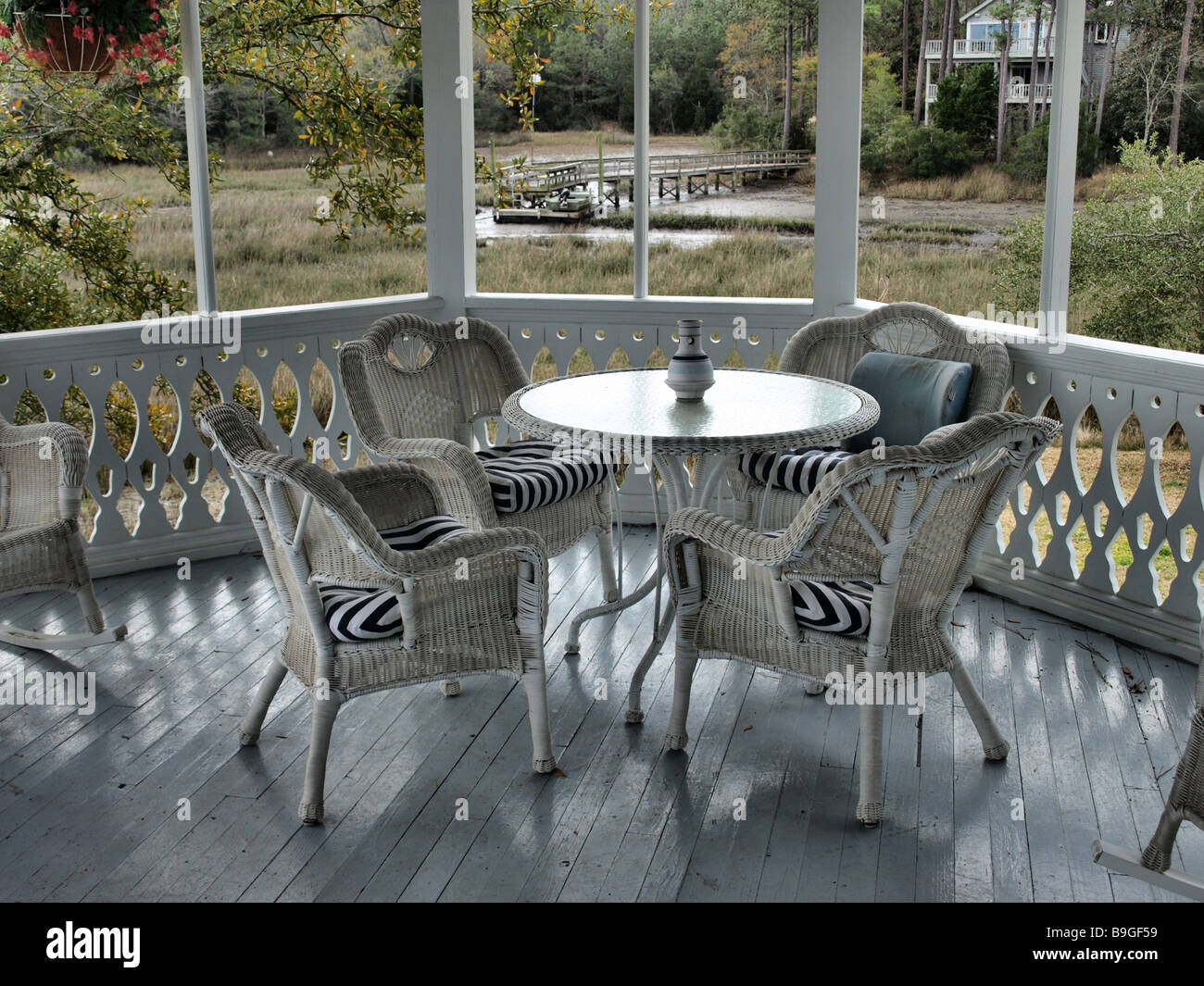 patio chairs and table overlooking marshlands wicker cupola on porch ...