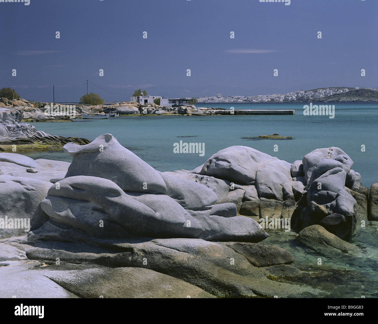 Greece Cyclades island Paros bay rocks pier boats background Naoussa ...