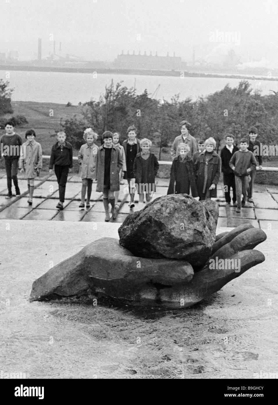 Magnitogorsk landmark a human hand holding a piece of iron ore Stock ...