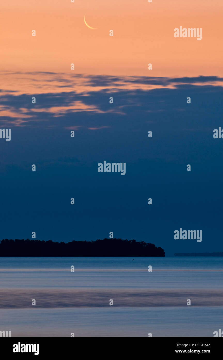 Moon sets as dawn lights mangrove islands in Florida Bay Everglades ...