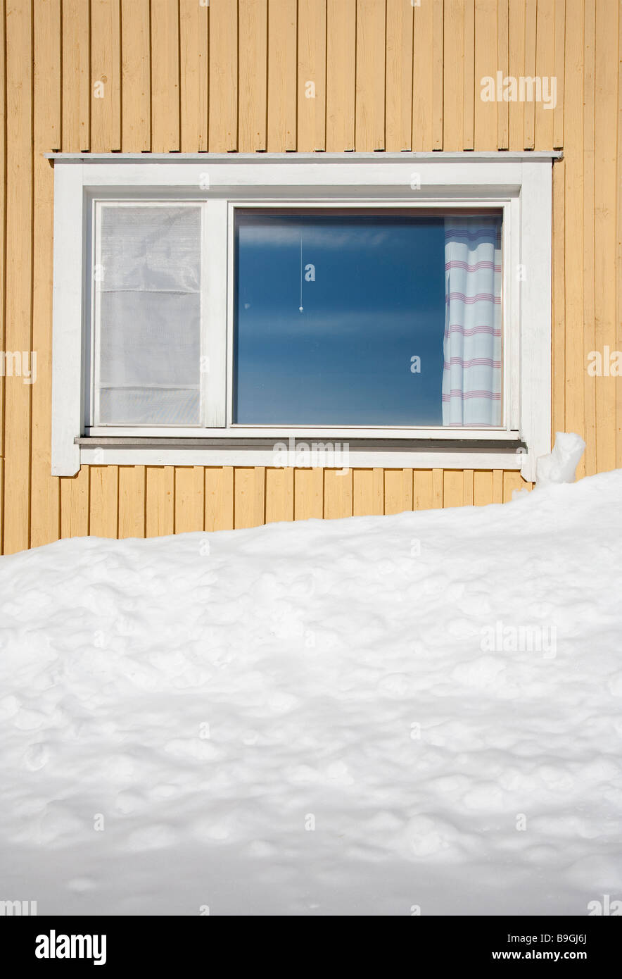 High snowbanks underneath window , Finland Stock Photo - Alamy