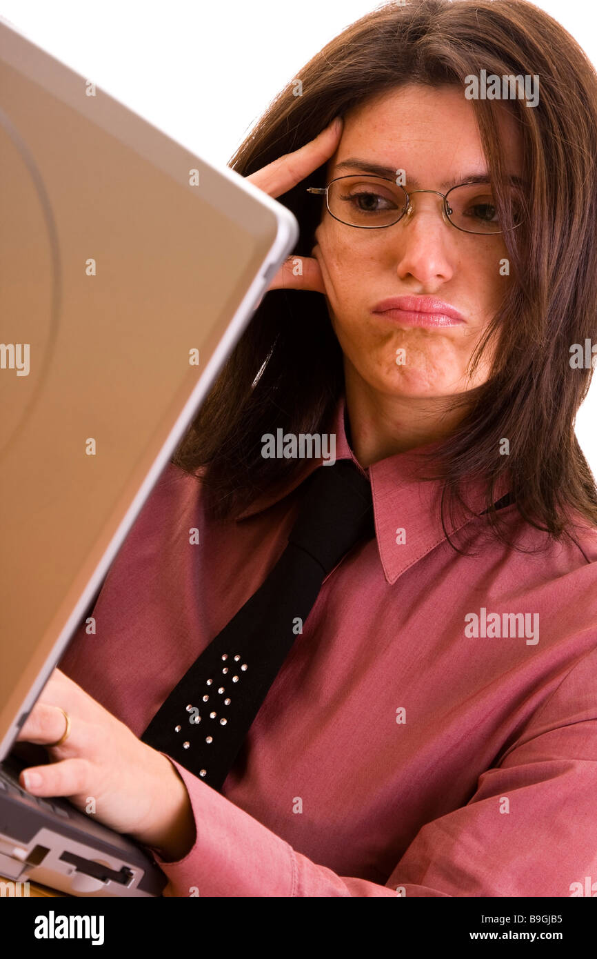 Annoyed brunette woman working hi-res stock photography and images - Alamy