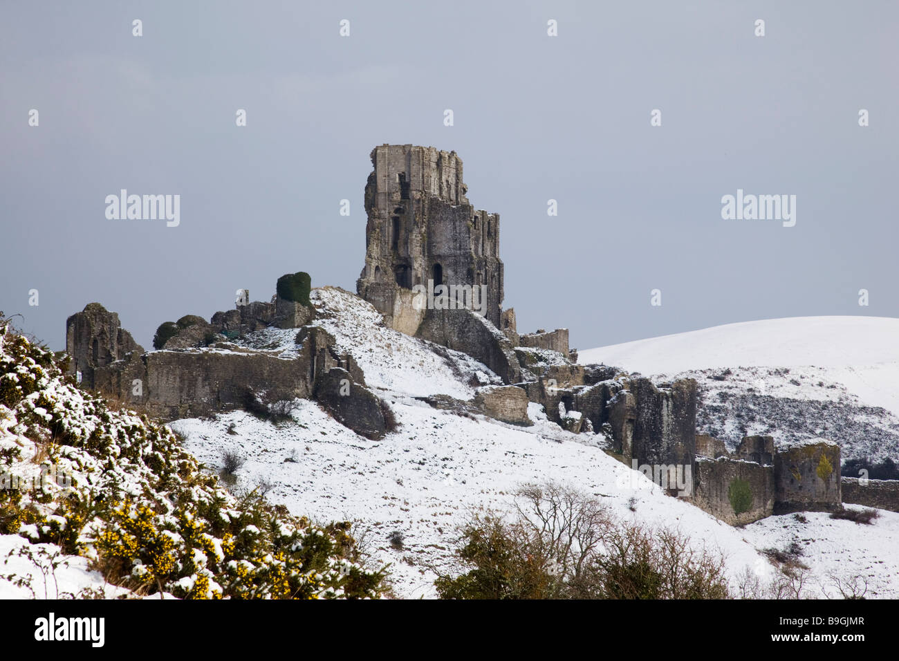 A rare fall of snow covers the Dorset landscape around the ruins of ...