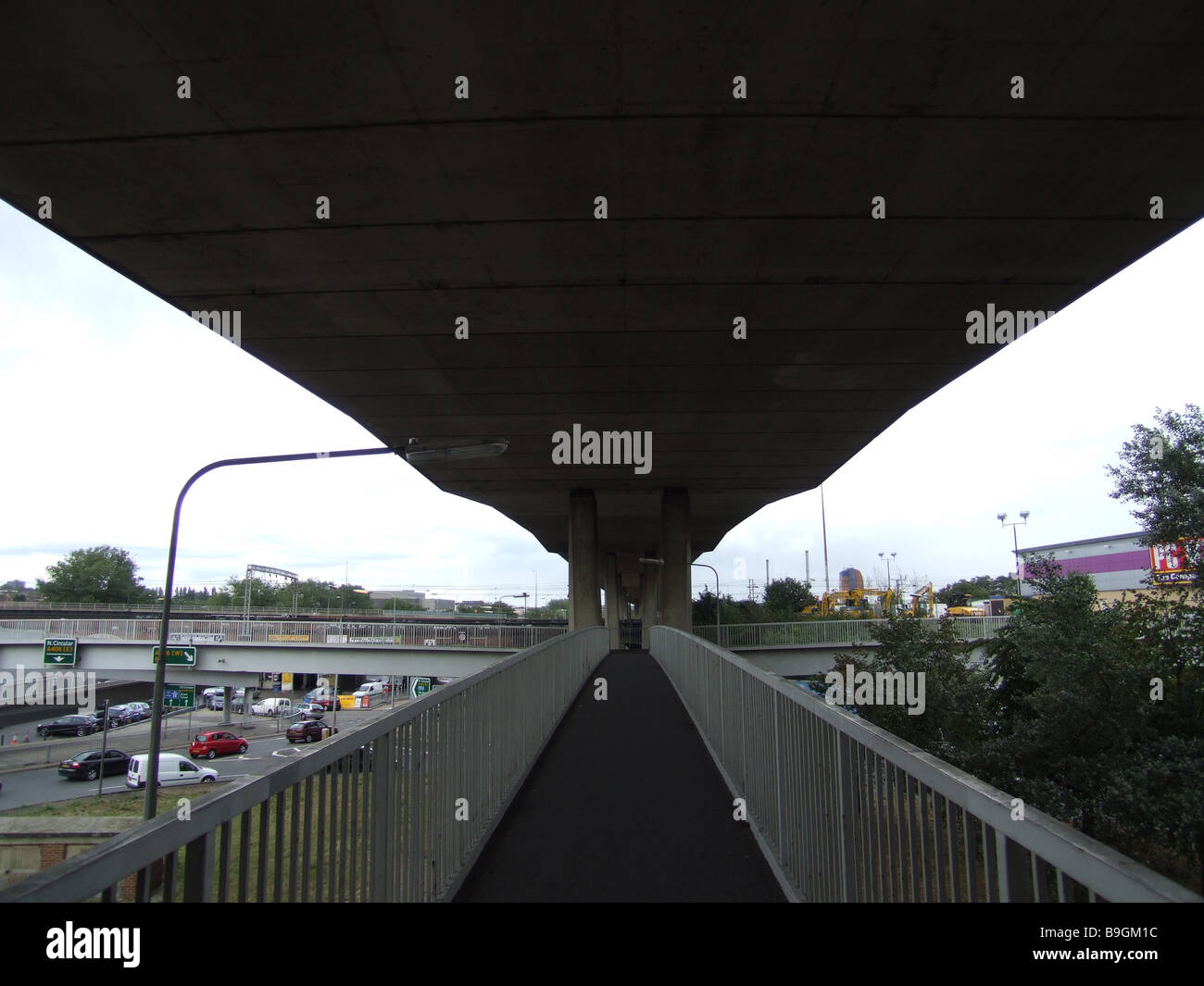 A footbridge under a flyover on the A406 , North Circular Road in ...