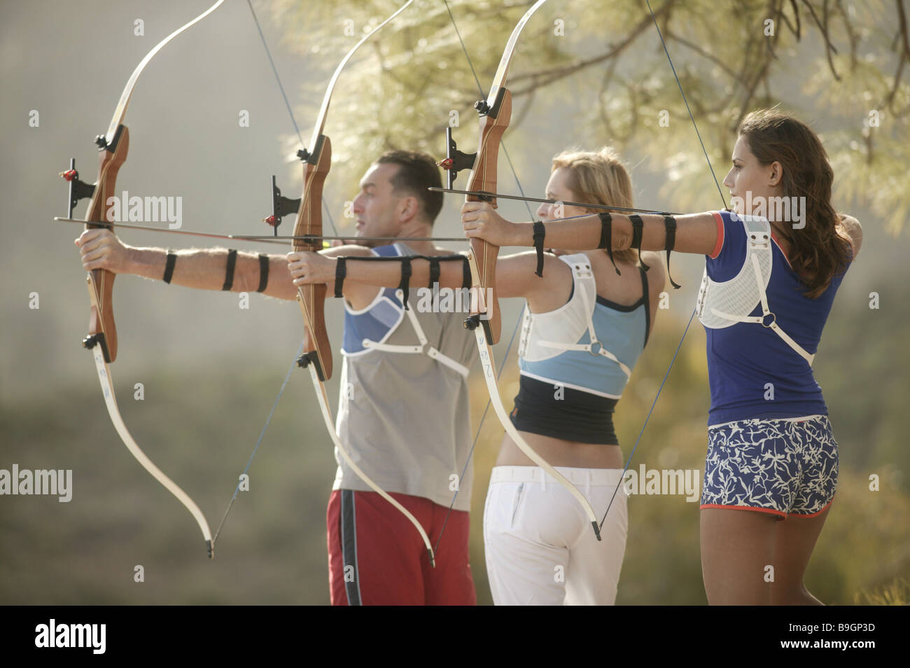 Group stands archery arrow bow destinations sport 18 years 40-50 years ...