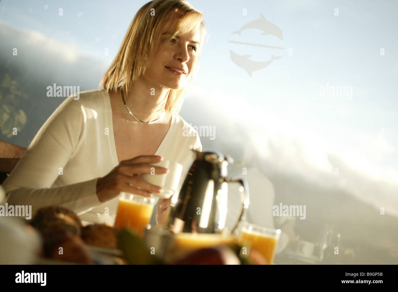 Woman sitting breakfast-table smiling portrait 40-50 years 41 year ...