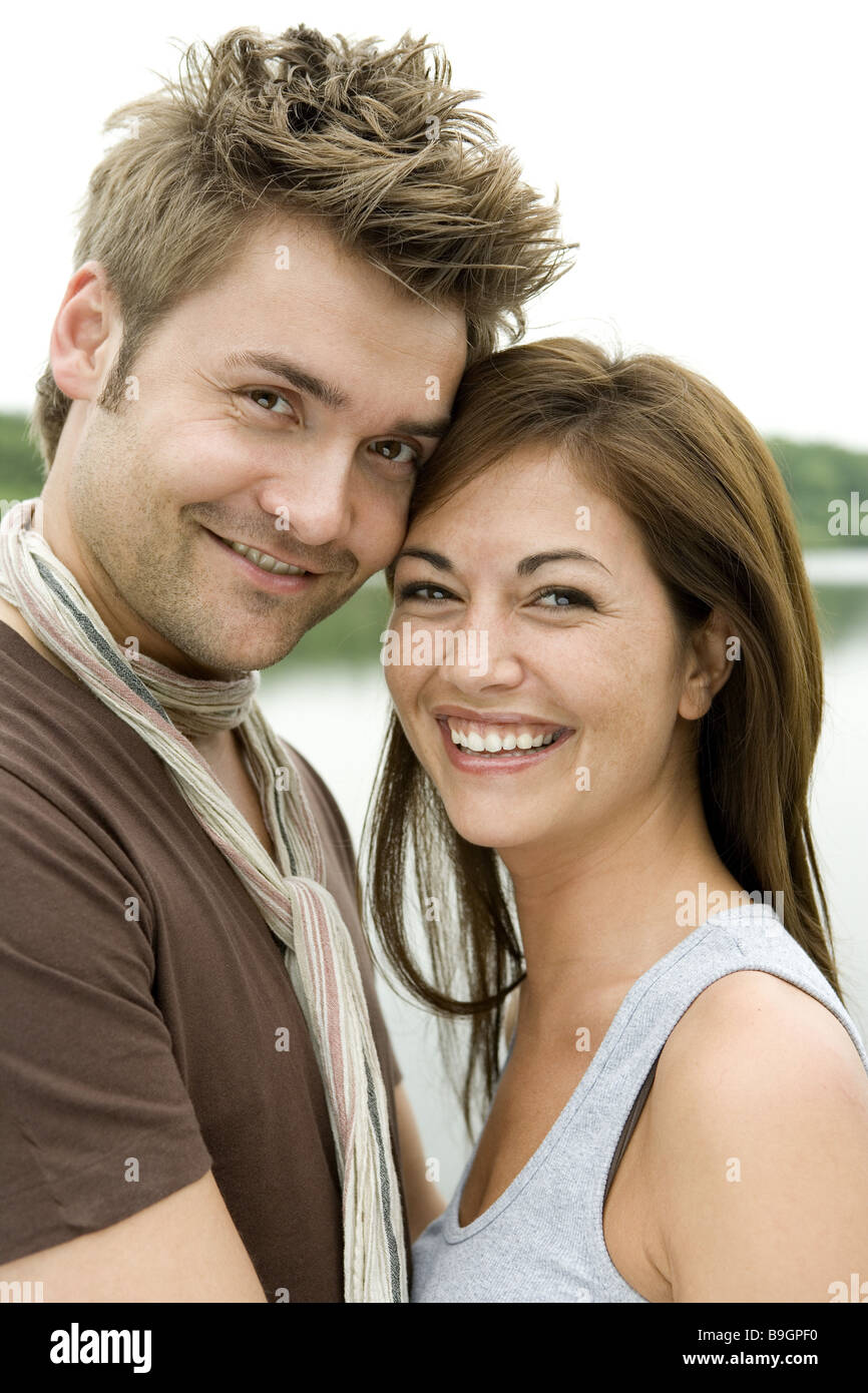 Shore couple embrace fallen in love semi-portrait Stock Photo - Alamy