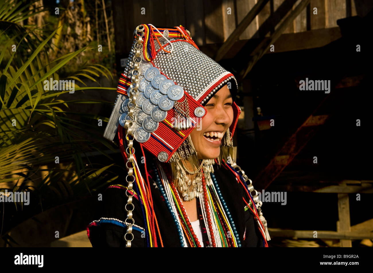 Portrait of An Akha woman wearing a traditional head wear Stock Photo ...