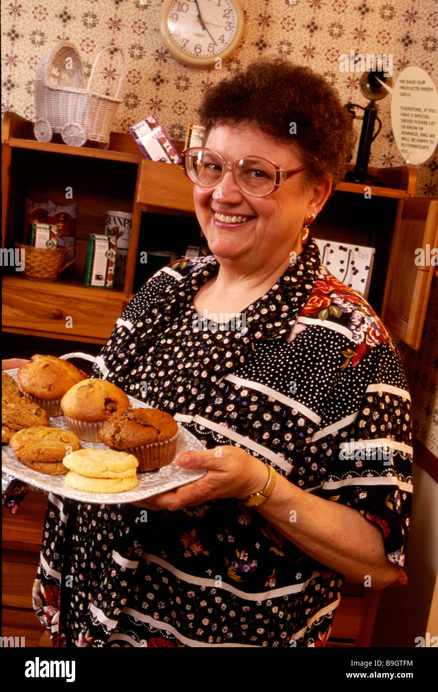 Grandmother with baked muffins Stock Photo - Alamy