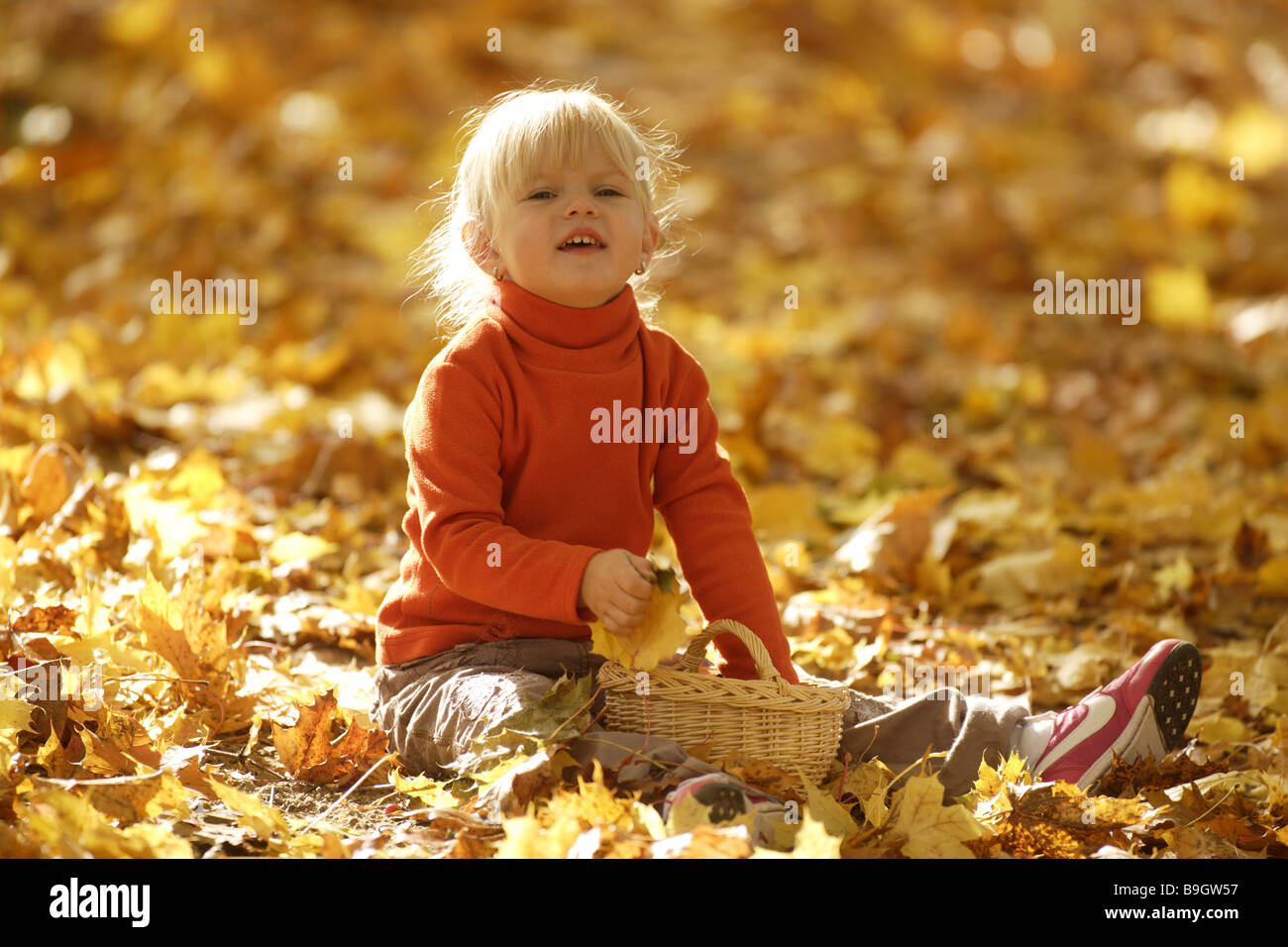 Forest child fall foliage sitting little basket leaves collects 2-4 ...