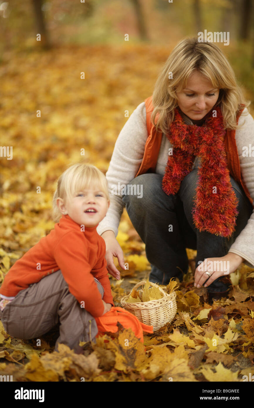 Collect forest mother daughter fall foliage Stock Photo - Alamy