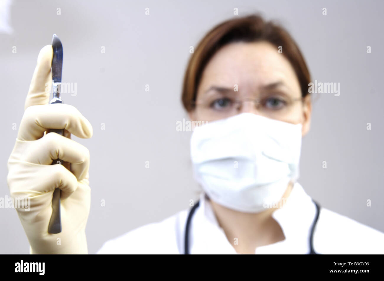 Doctor scalpel gesture portrait blur series people woman doctor's white ...