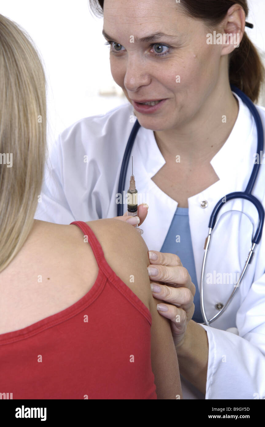 Pediatrician girl upper arm vaccination series people doctor woman ...