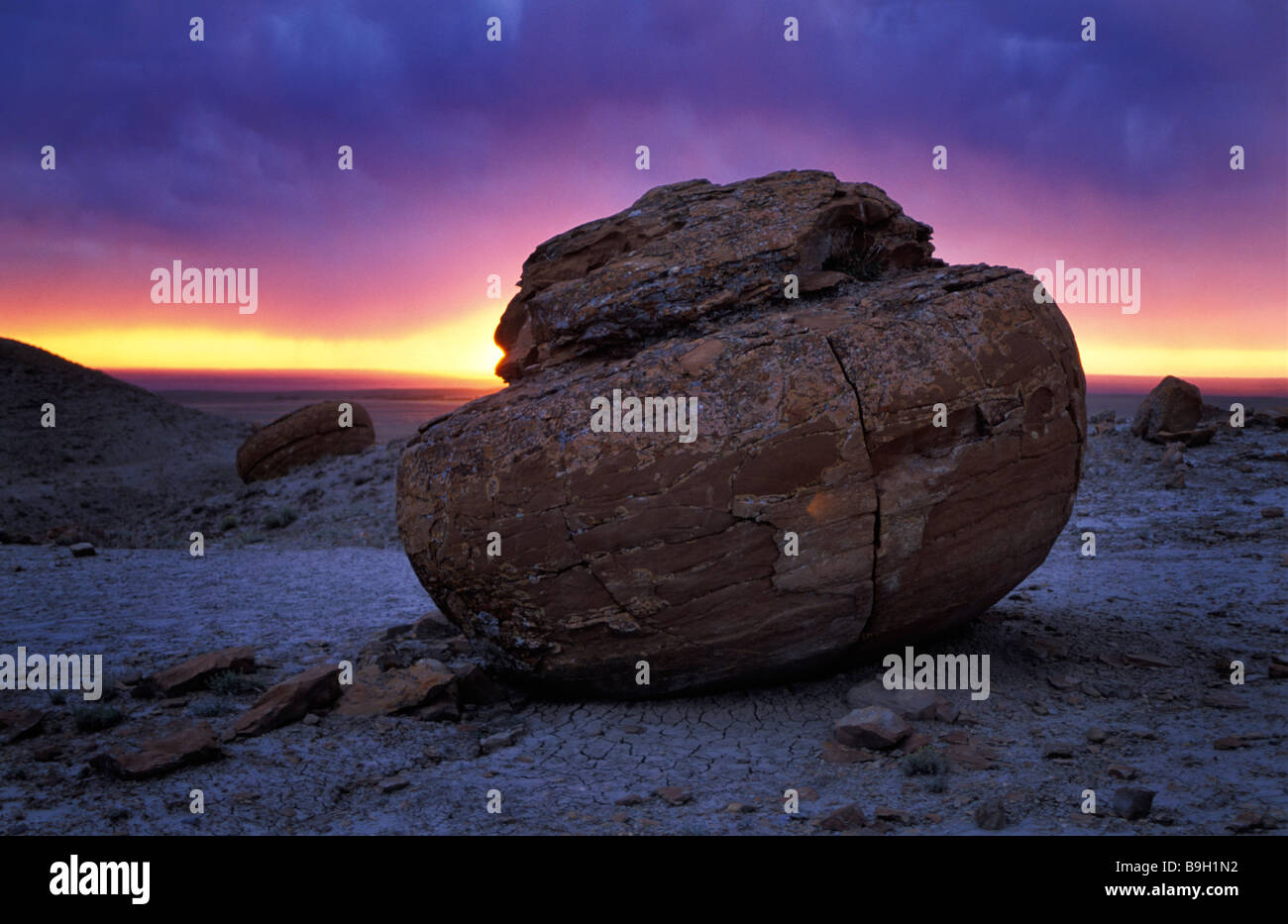 Large red sandstone boulders on the prairie at Red Rock Coulee Natural ...