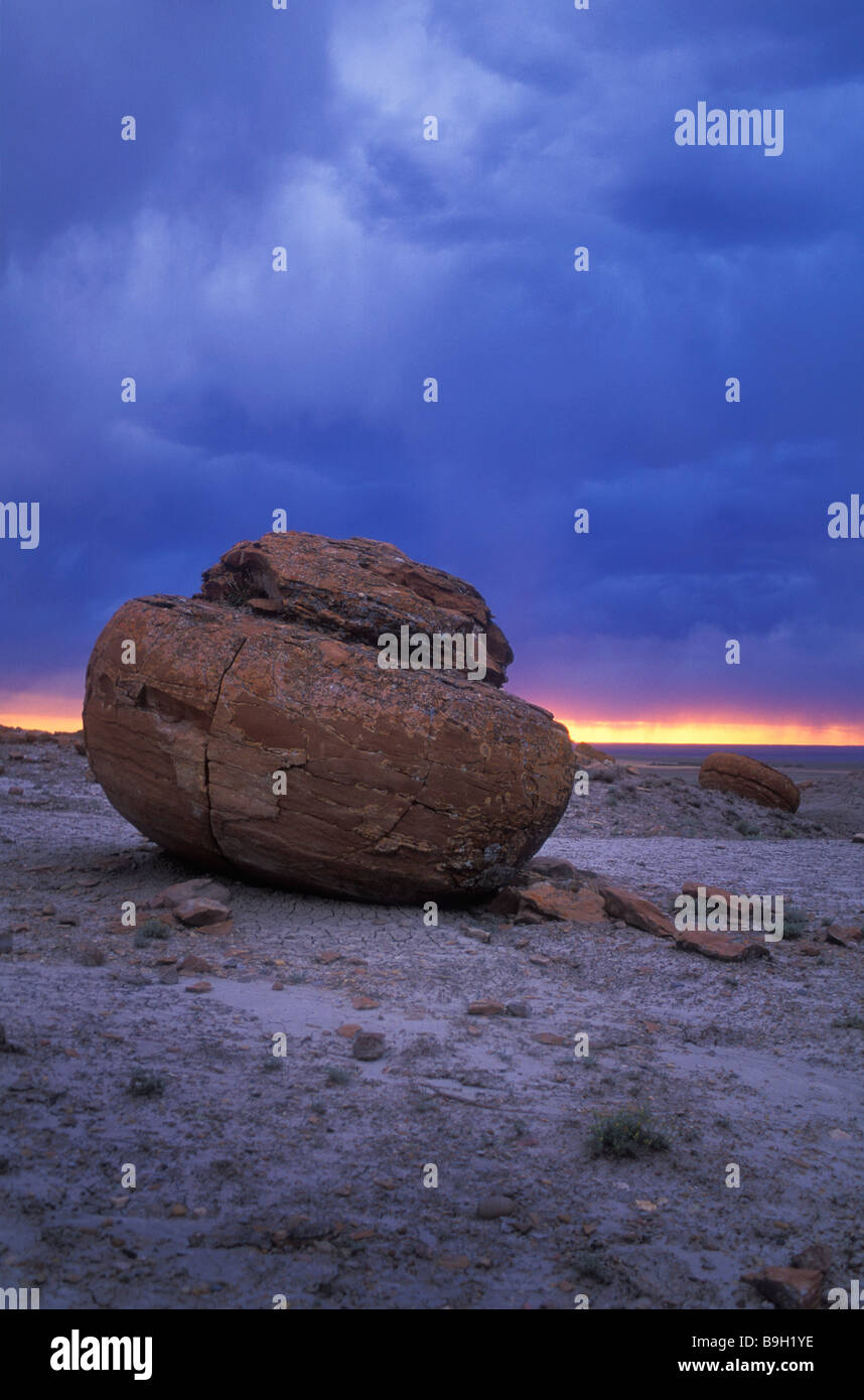 Large red sandstone boulders on the prairie at Red Rock Coulee Natural ...