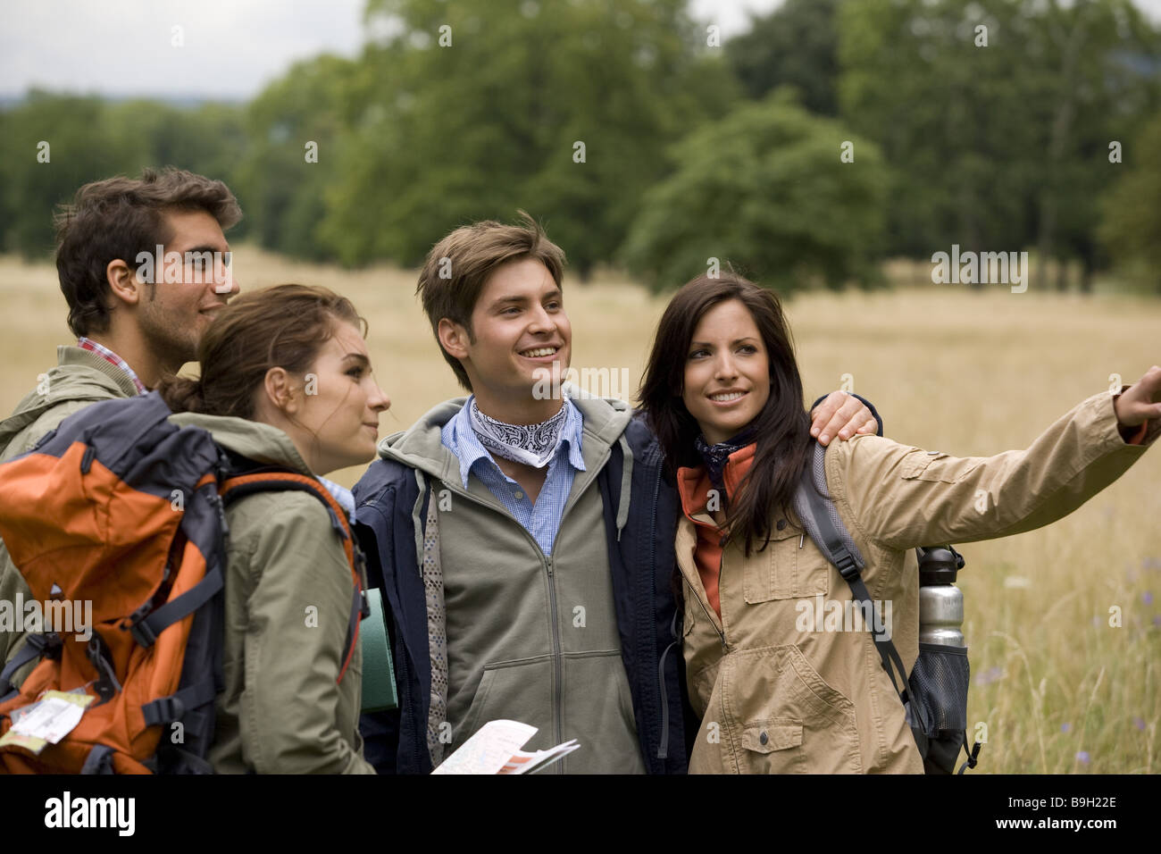 Group hikes smiling leisure time nature semi-portrait outside 20-30 ...