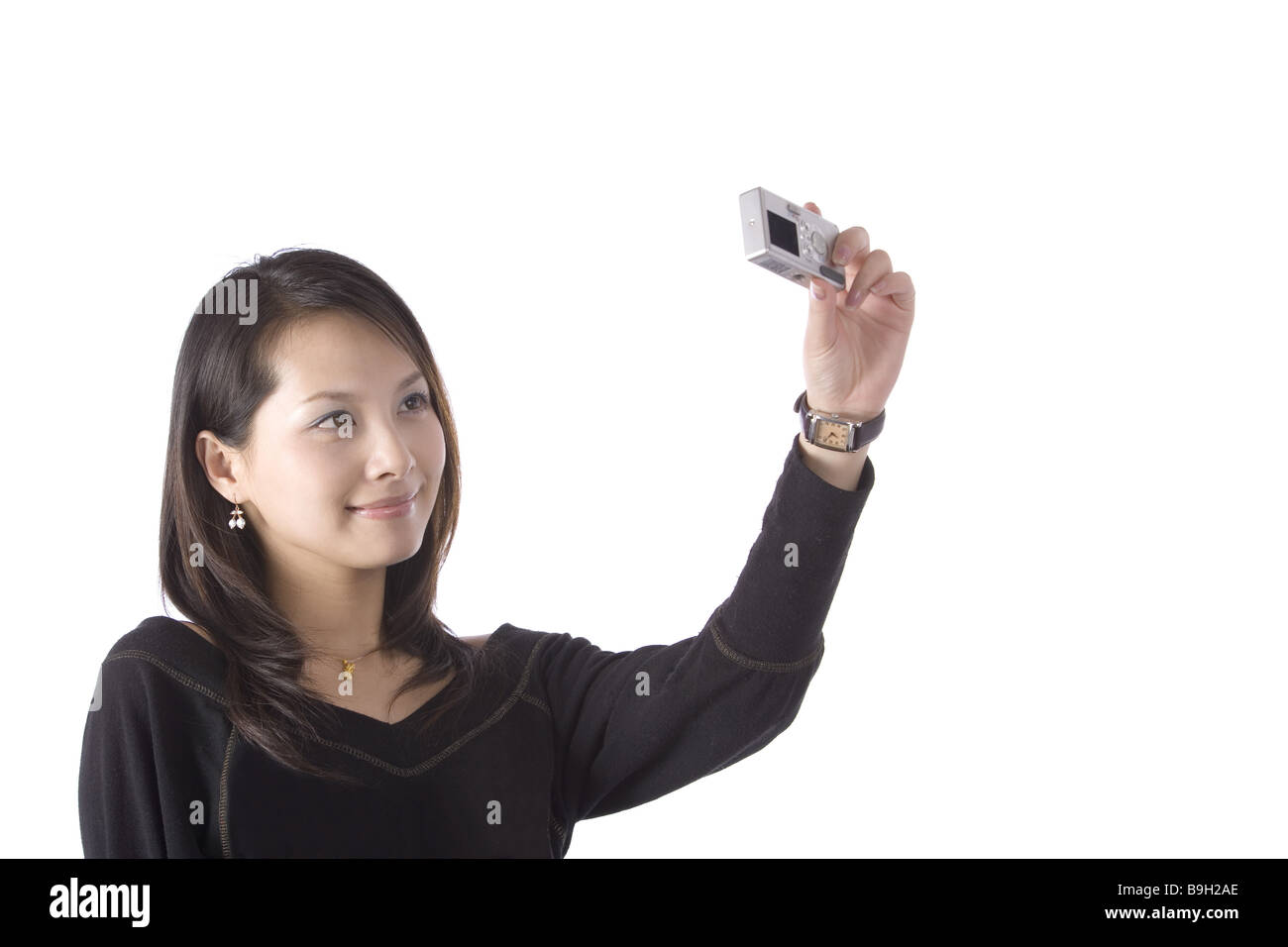 One young woman taking picture with camera portrait smiling Stock Photo ...