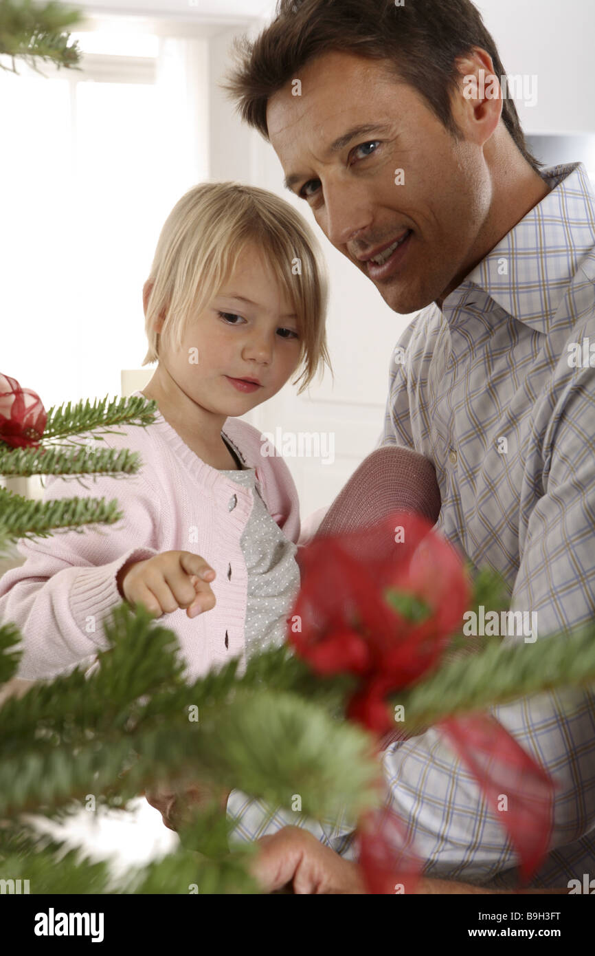 Father daughter christmas-tree views semi-portrait Stock Photo - Alamy