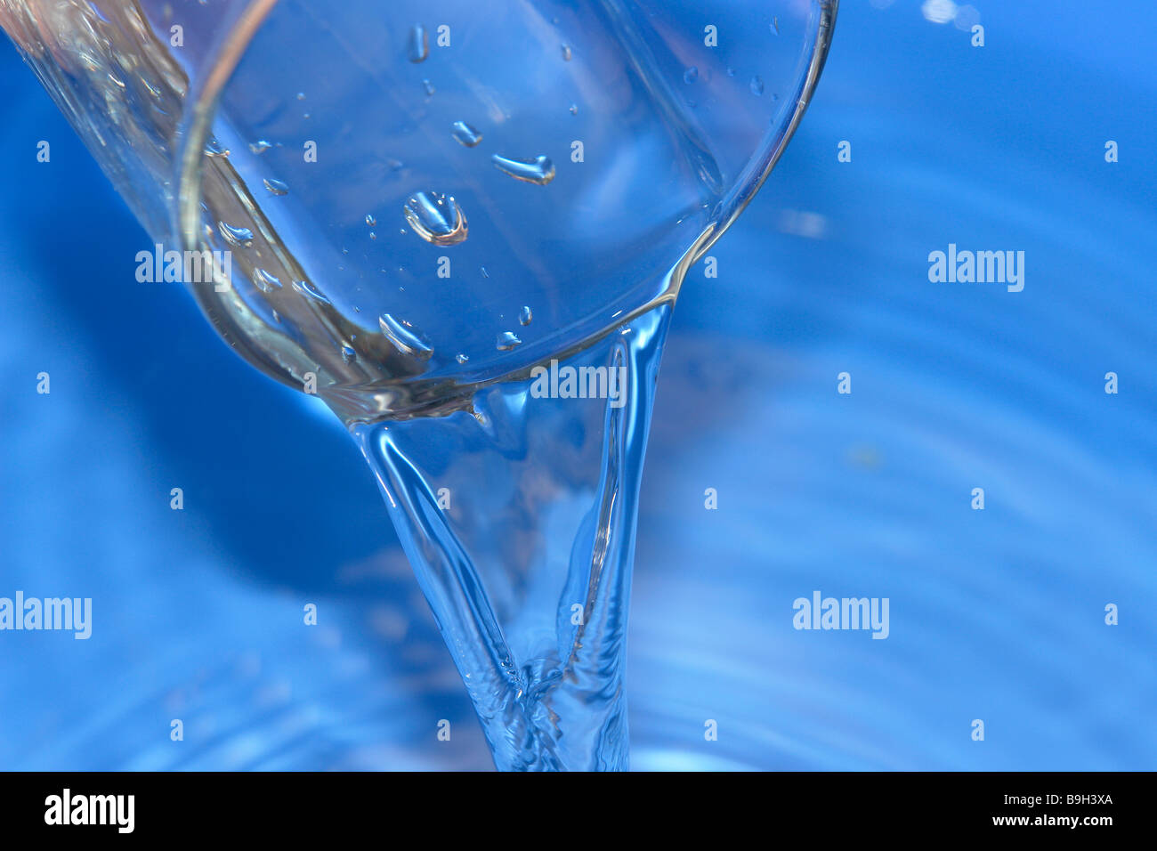 Glass of water poured out (detail Stock Photo - Alamy